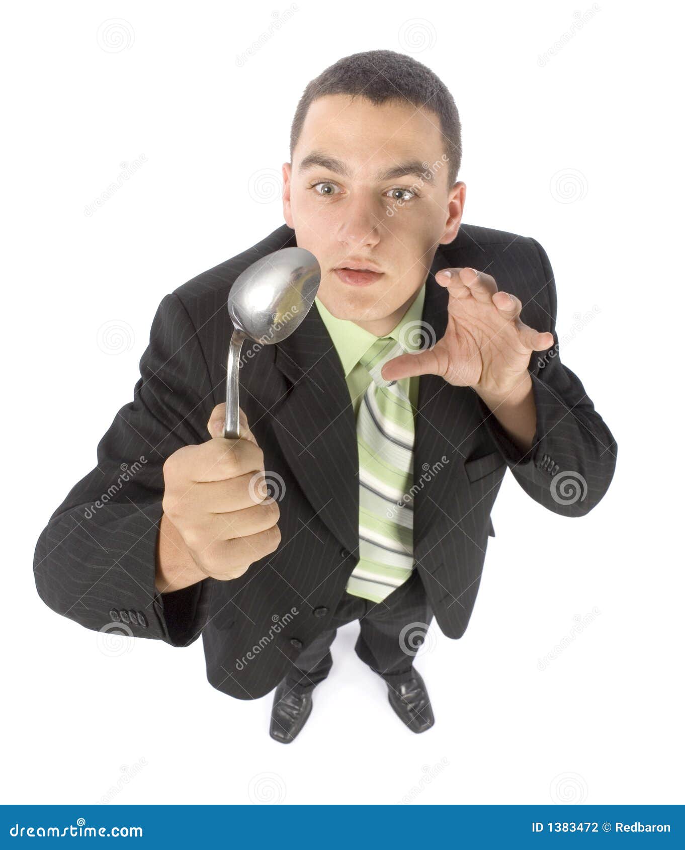 Businessman Bending Spoon by Mind Force Stock Photo - Image of genius ...