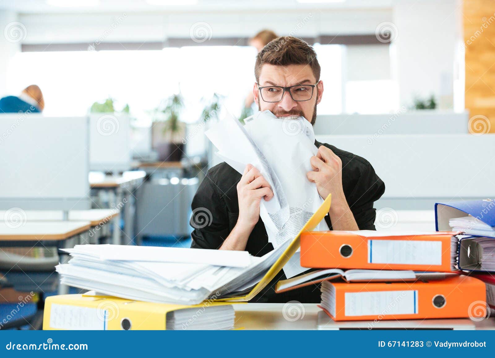 Businessman Biting Paper in Office Stock Image - Image of angry ...