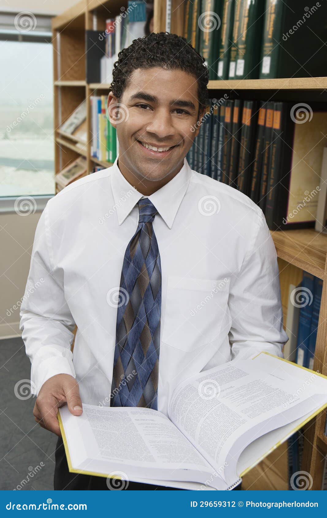 Businessman with Book at Library Stock Photo - Image of book, holding ...