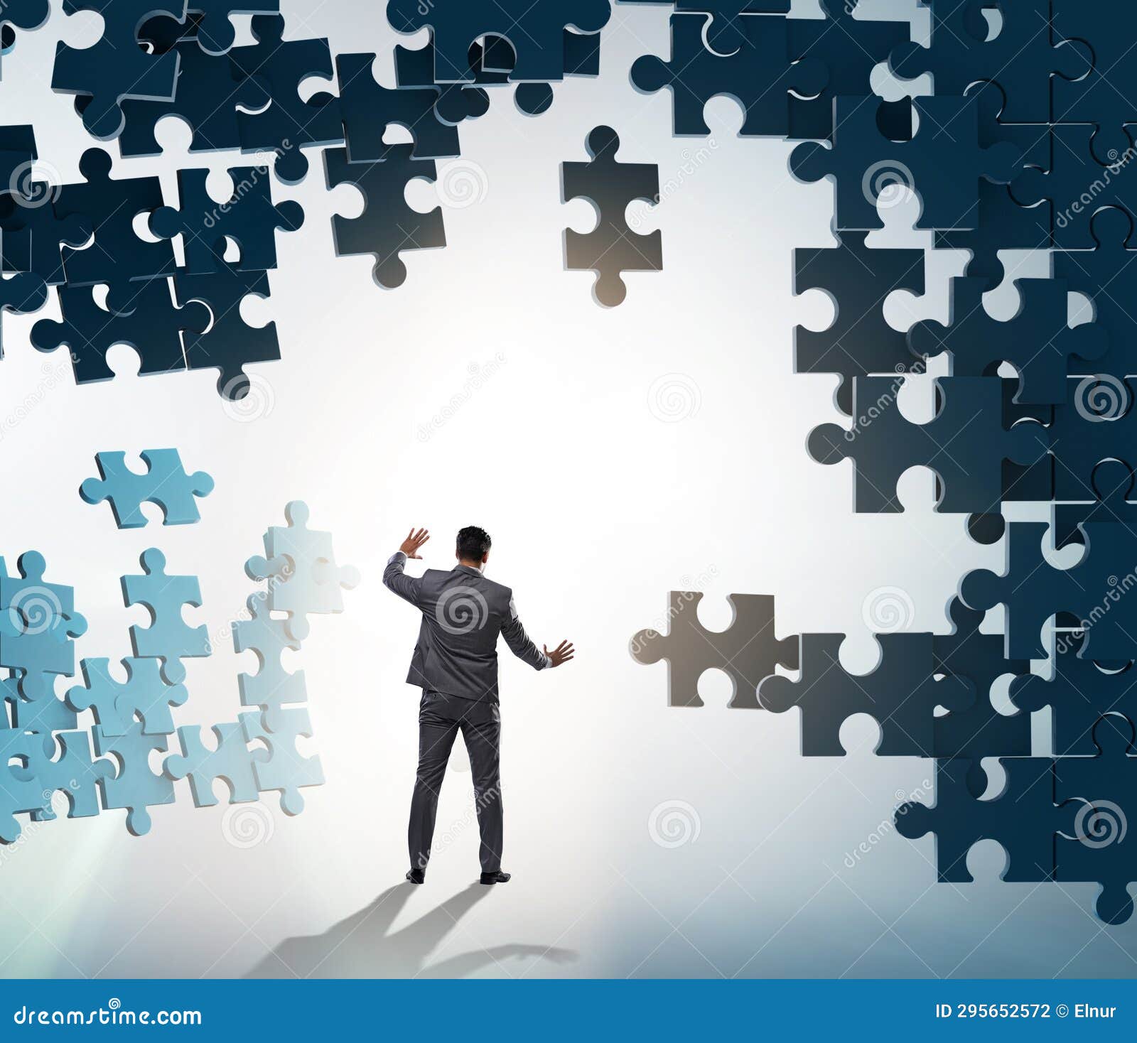 Businessman Breaking the Wall of Jigsaw Puzzle Stock Photo - Image of ...