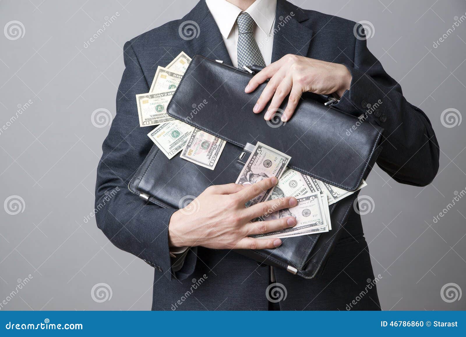 Businessman with a Briefcase Full of Money in the Hands of Stock Photo ...