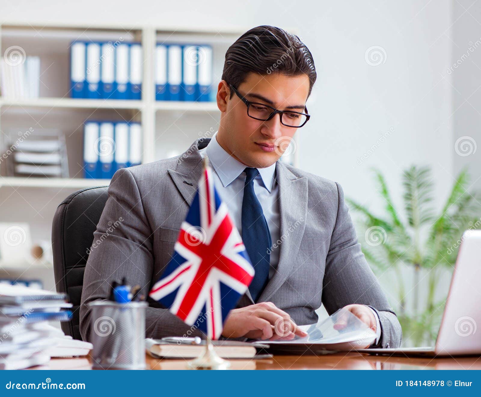 Businessman with British Flag in the Office Stock Photo - Image of ...