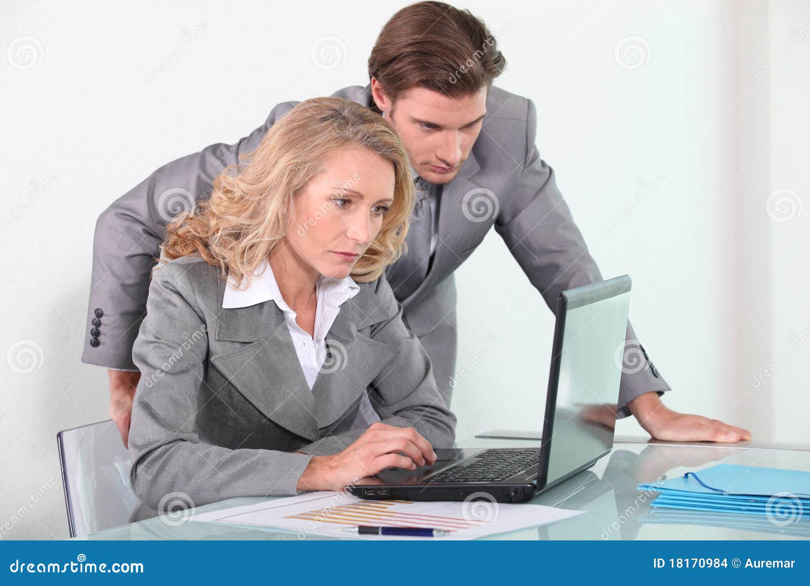Businessman and Businesswoman with Laptop Computer Stock Photo - Image ...