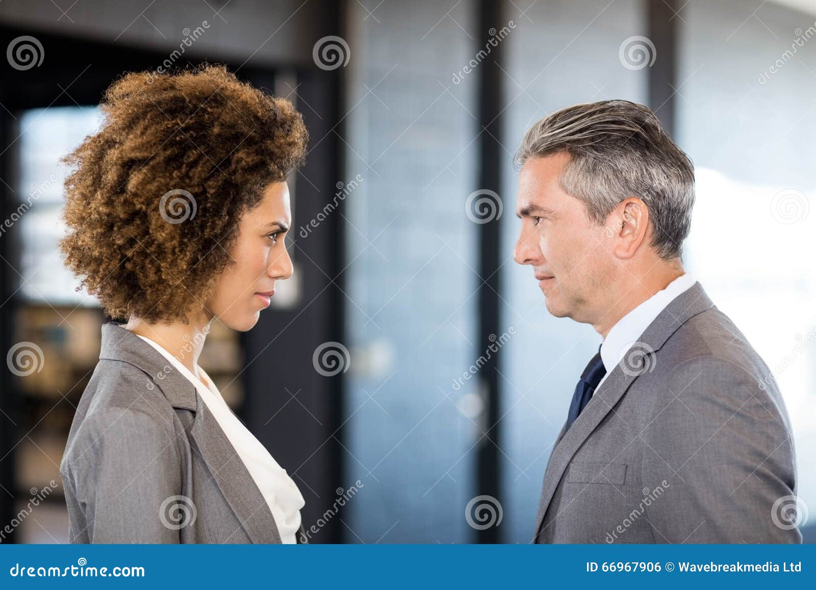 Businessman and Businesswoman Standing Face To Face Stock Photo - Image ... Businessman and Businesswoman Standing Face To Face Stock Photo - Image ...