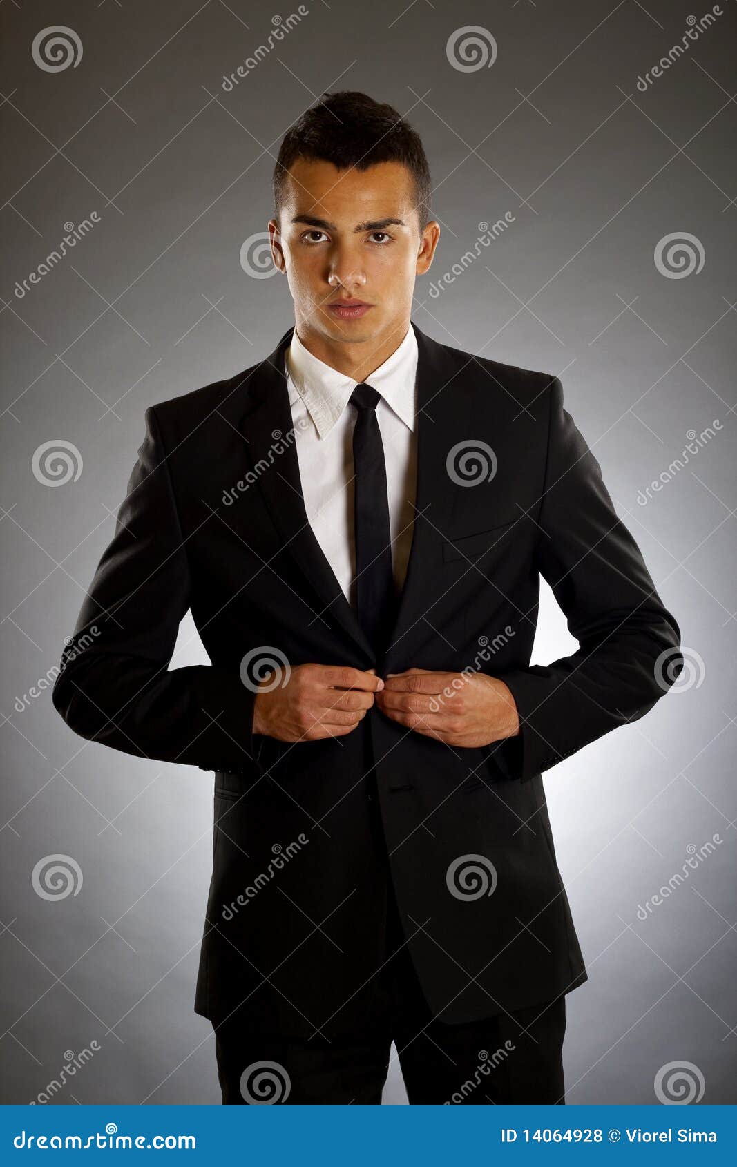 Businessman buttons up stock photo. Image of looking - 14064928