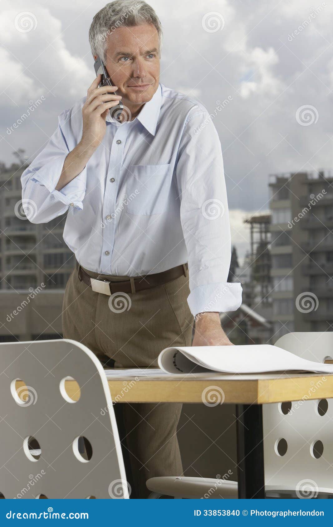 Businessman on Call in Office Stock Photo - Image of business, holding ...