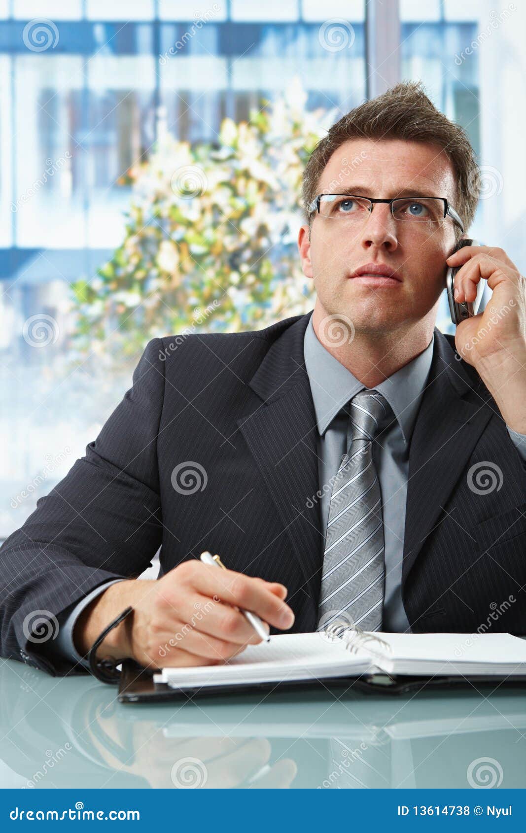 Businessman on Call Taking Notes Stock Photo - Image of employee, color ...