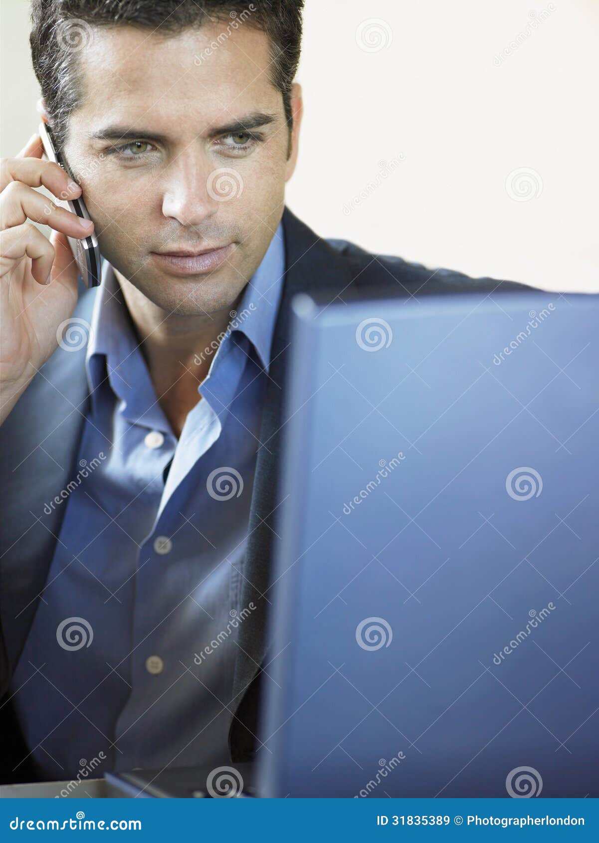 Businessman on Call while Using Laptop Stock Image - Image of adult ...
