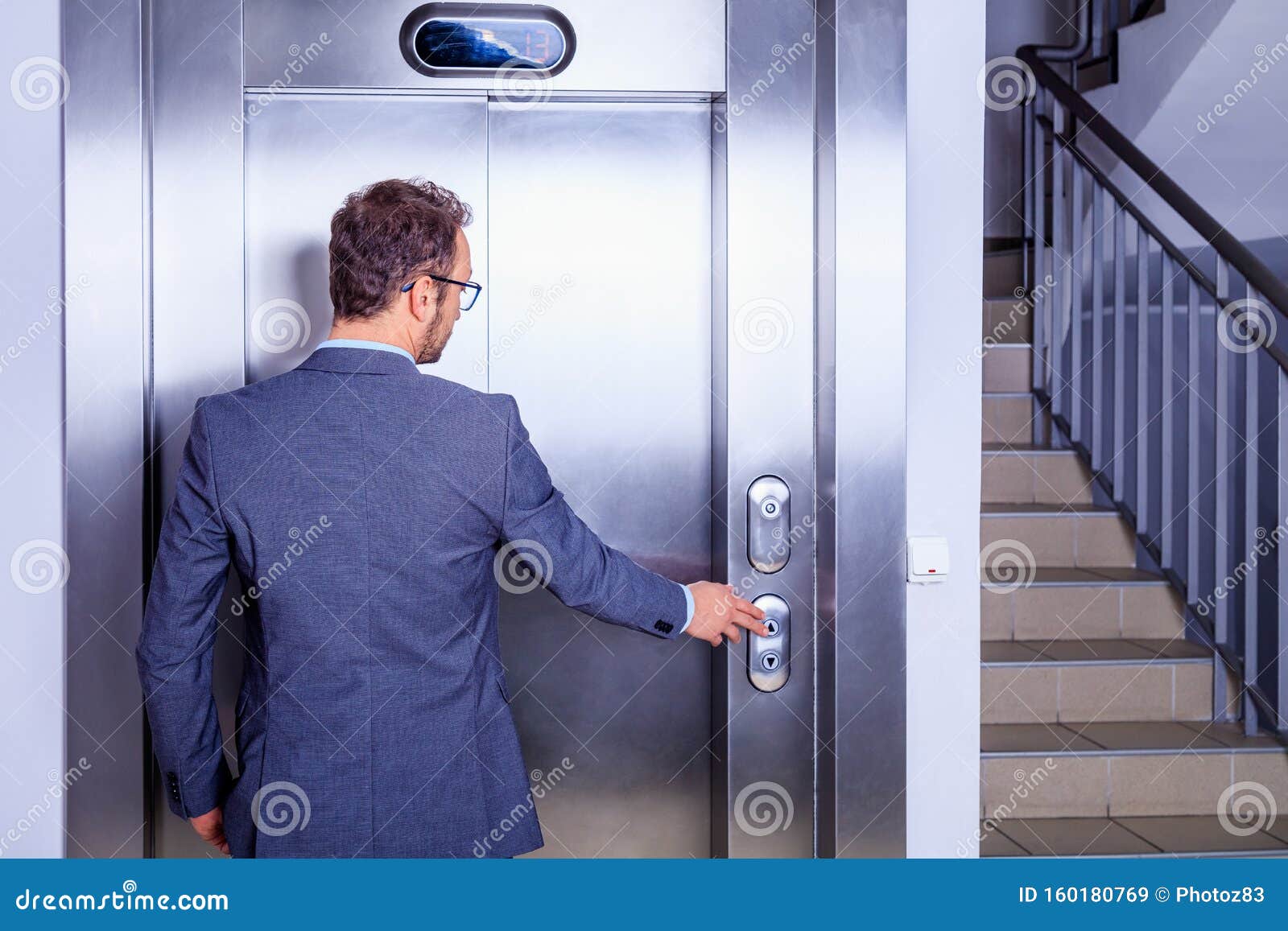 Young Professional in Suit Waiting in Front of the Elevator Stock Image ...
