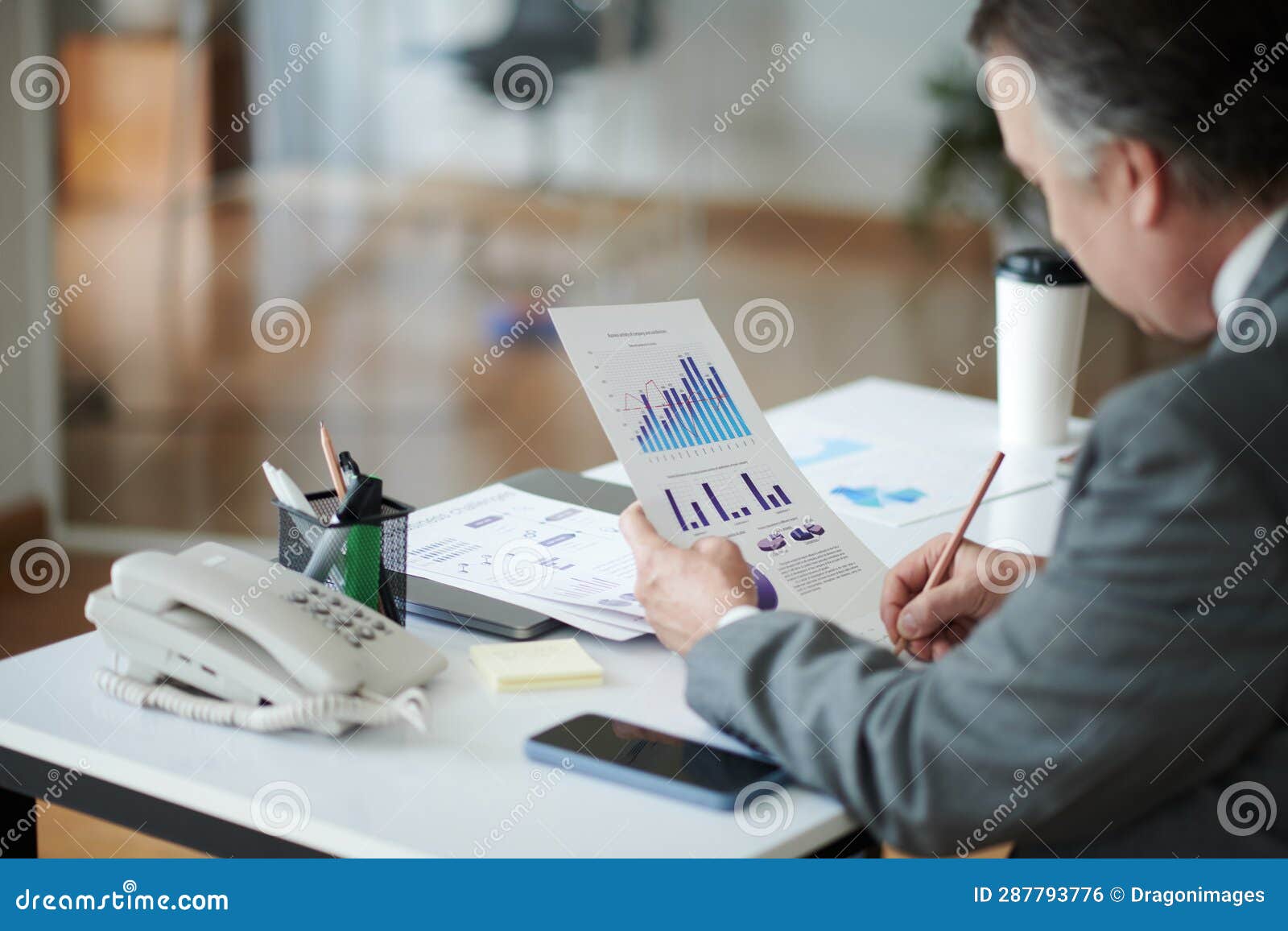 Businessman Checking Charts Stock Photo - Image of planning, strategy ...