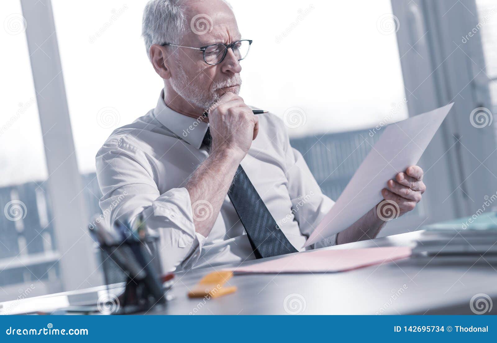 Businessman Checking a Document Stock Photo - Image of documents ...