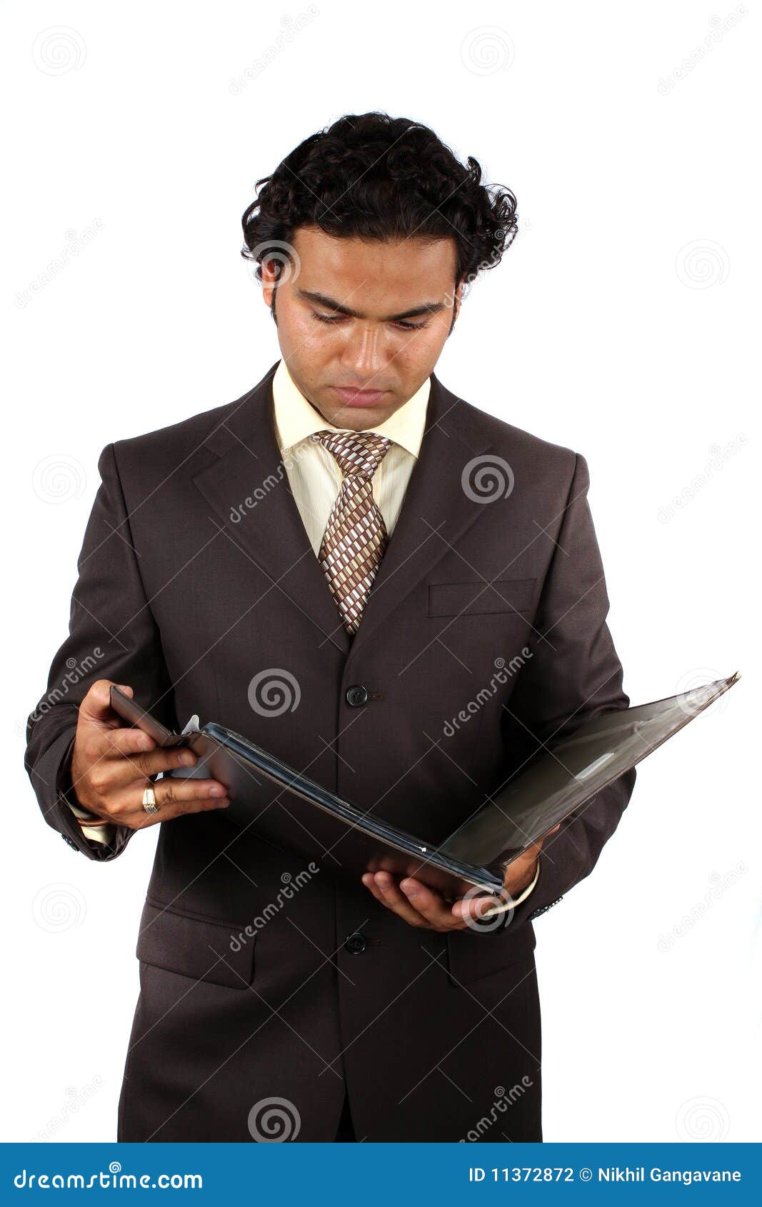 Businessman Checking File stock photo. Image of suit - 11372872