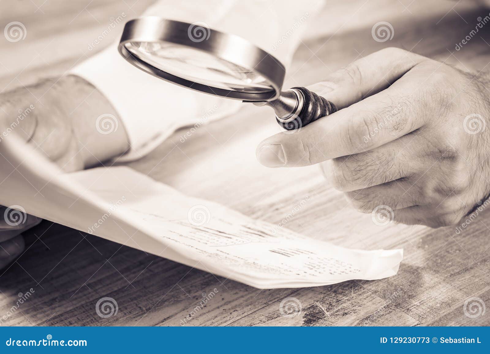 Businessman Checking His Documents with a Magnifying Glass, Monochrome ...