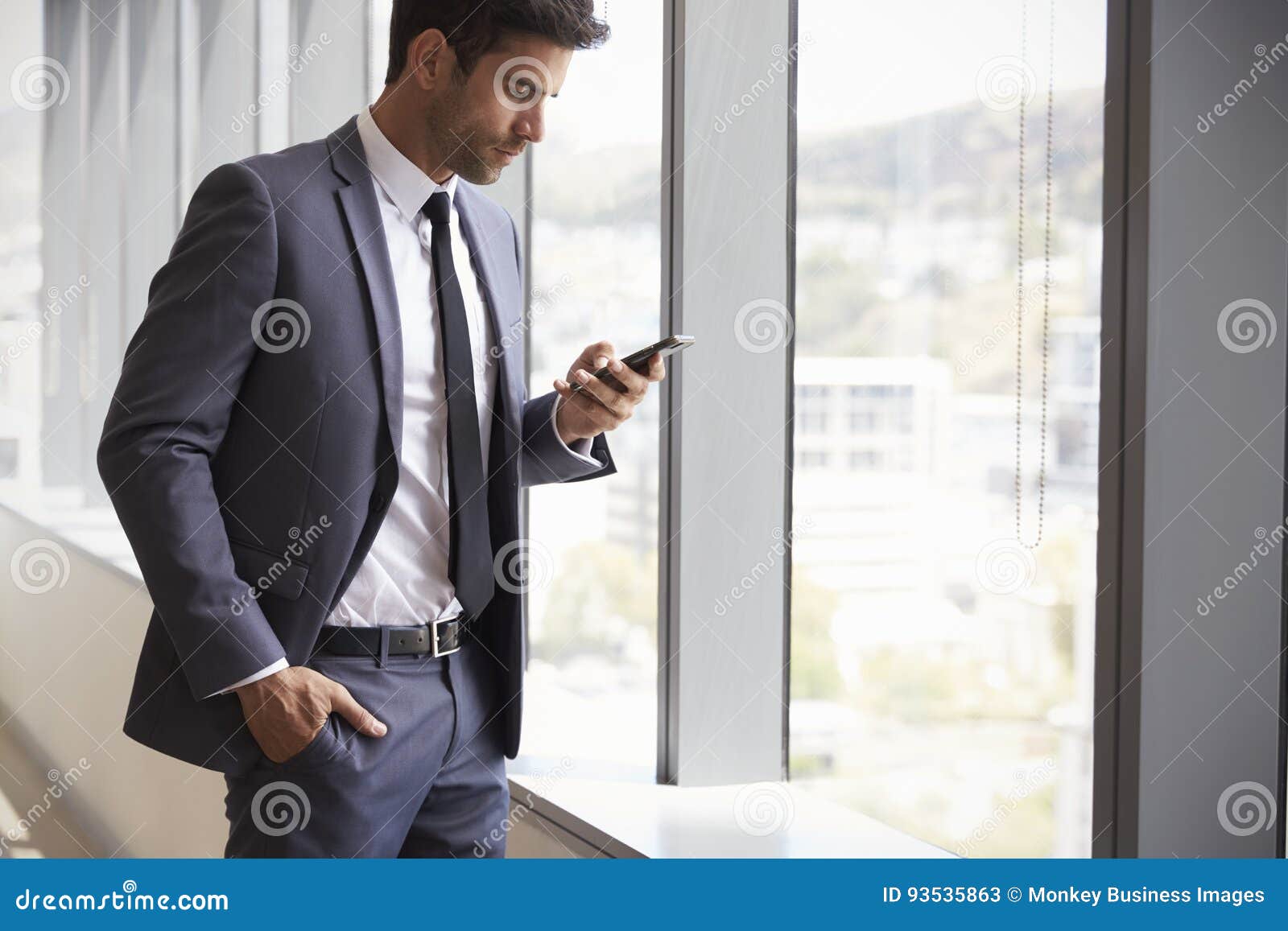 Businessman Checking Messages on Mobile Phone Stock Image - Image of ...