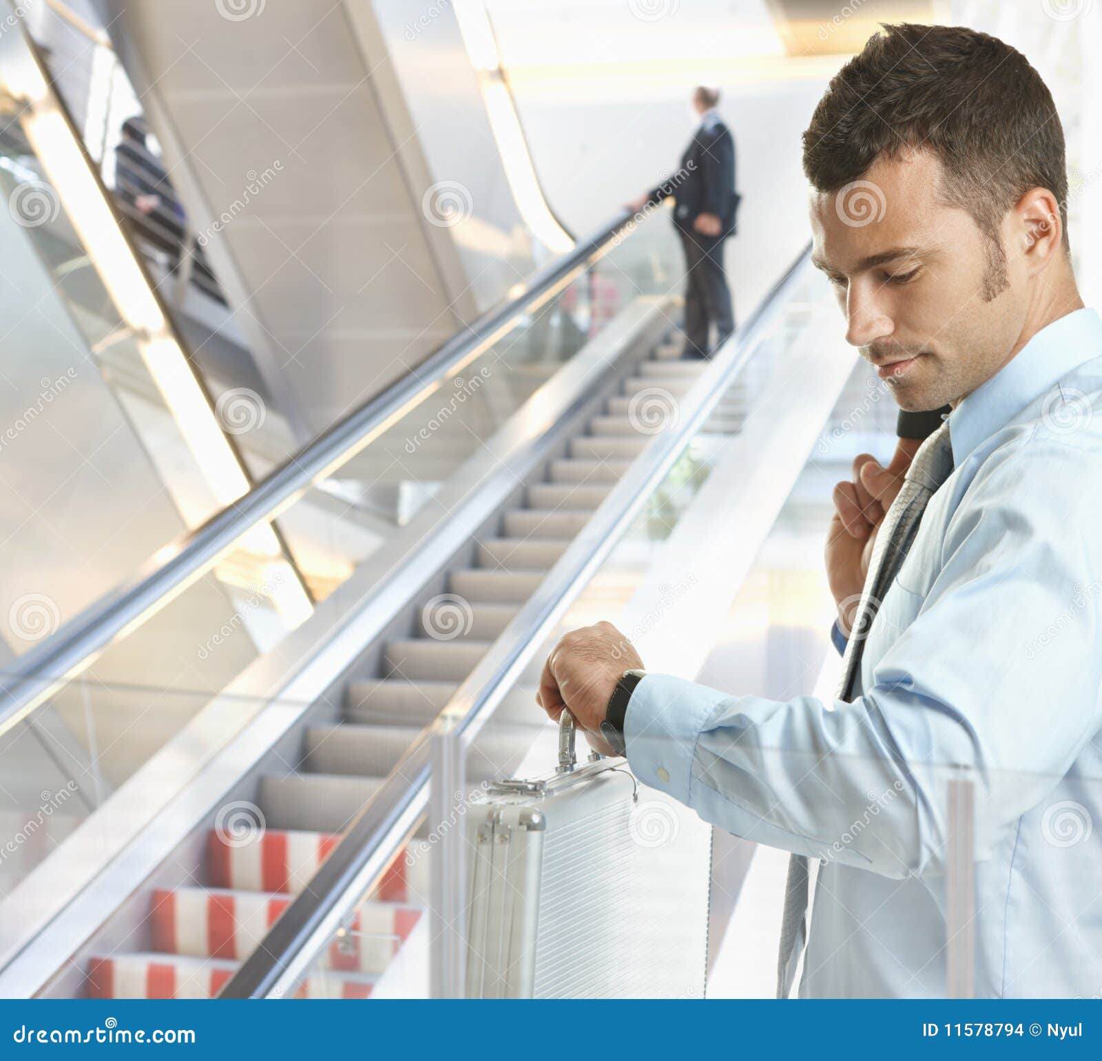 Businessman checking time stock photo. Image of face - 11578794