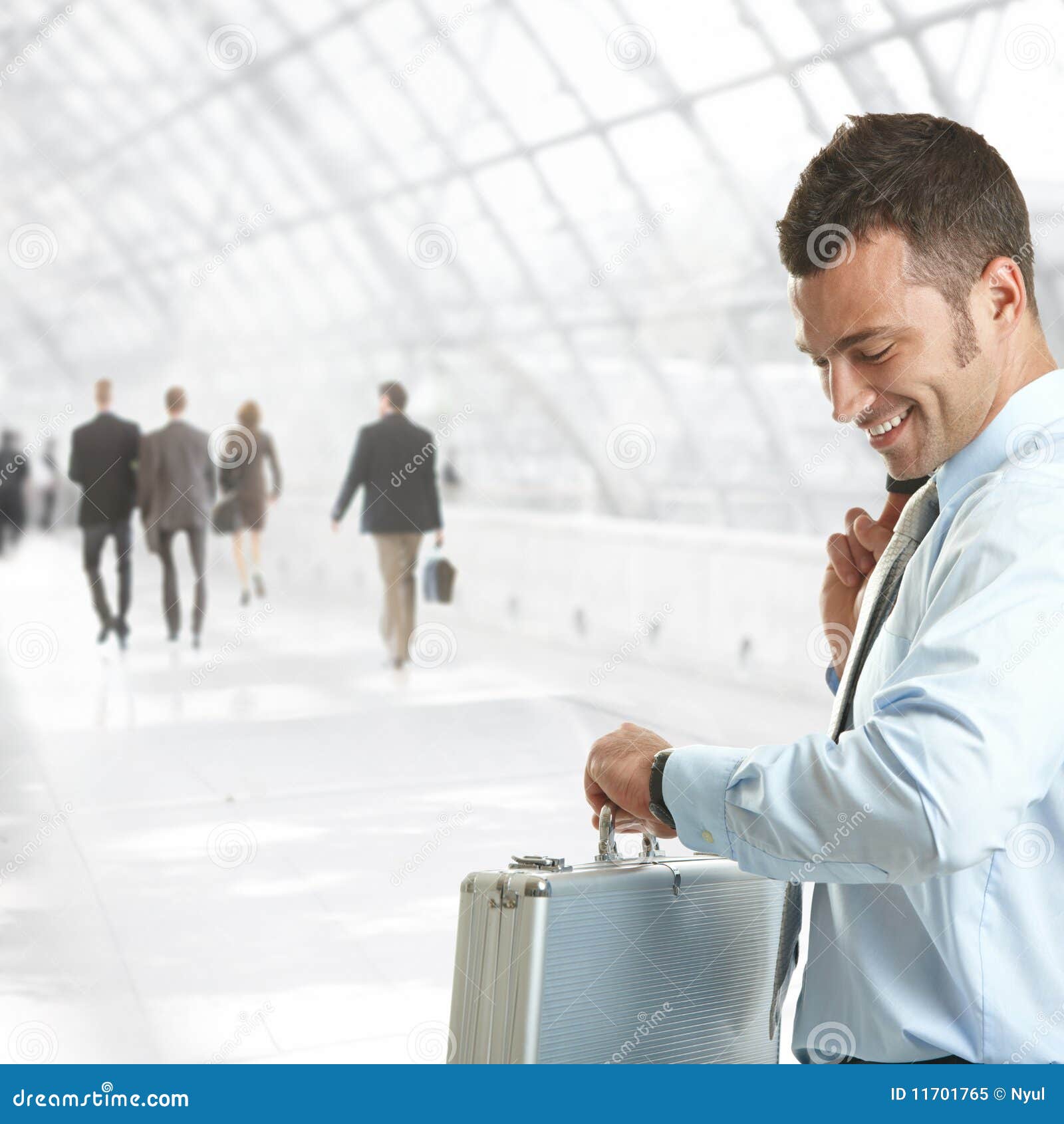 Businessman checking time stock image. Image of businessman - 11701765