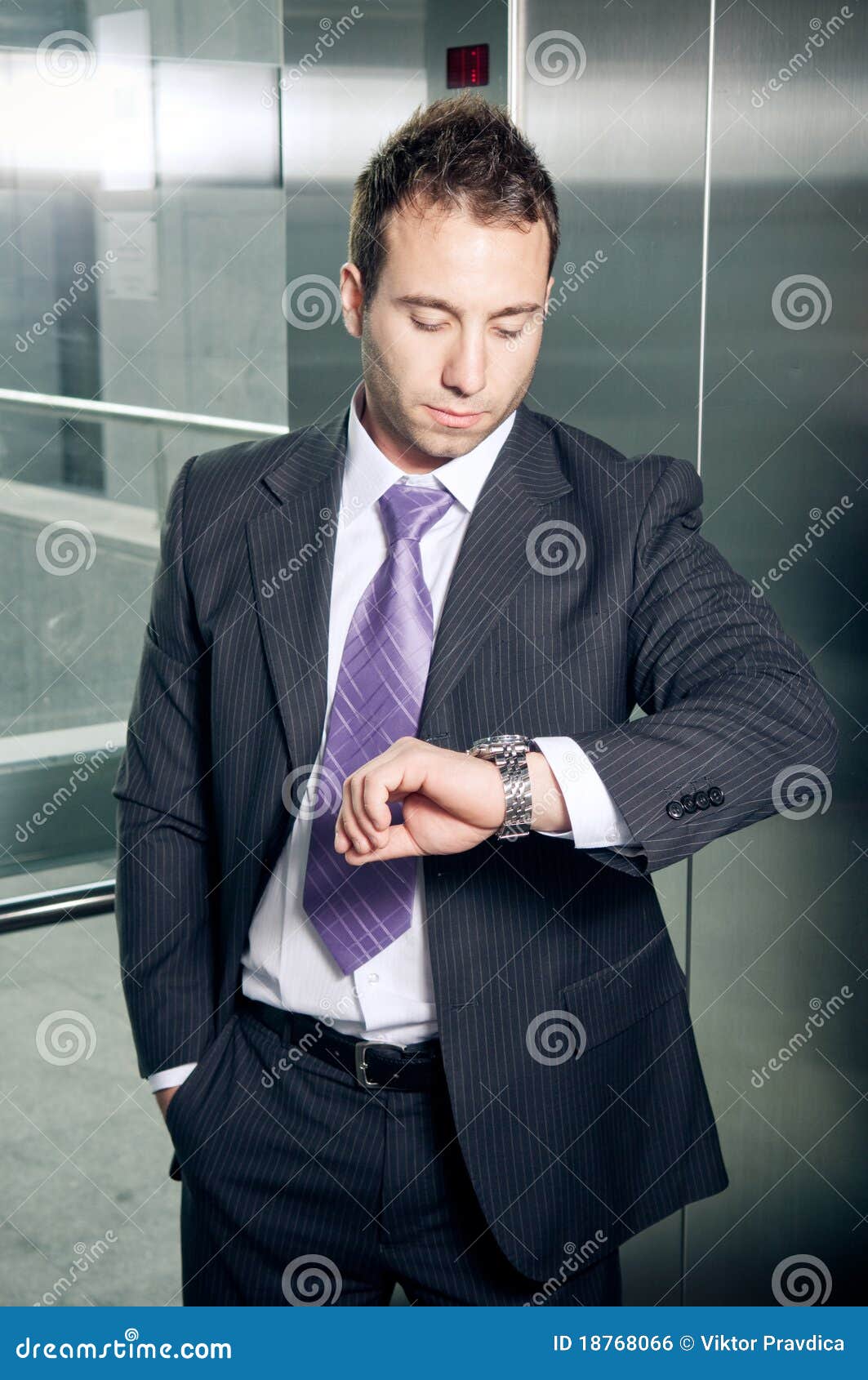 Businessman checking time stock photo. Image of handsome - 18768066