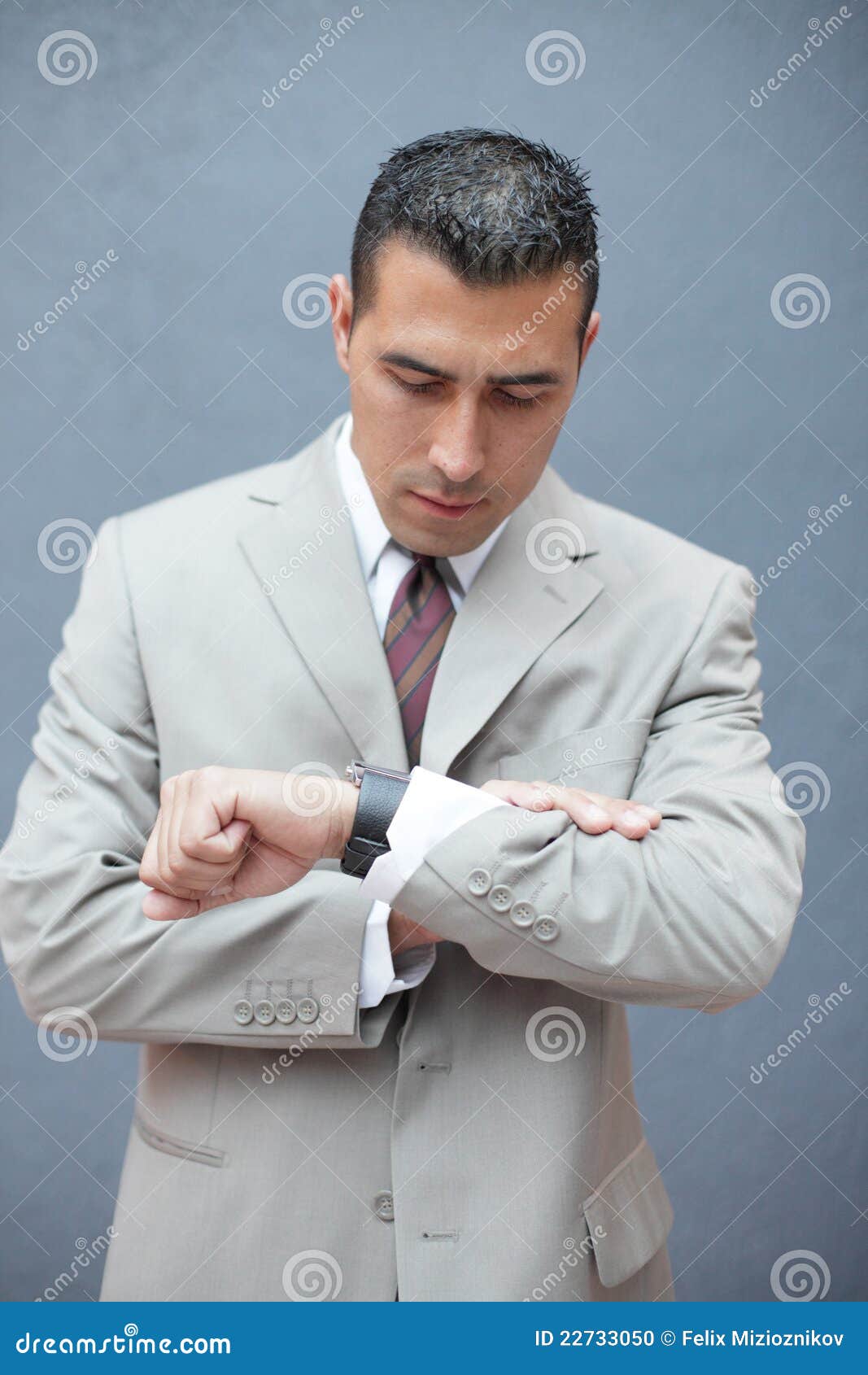 Businessman Checking the Time Stock Photo - Image of outside, wall ...