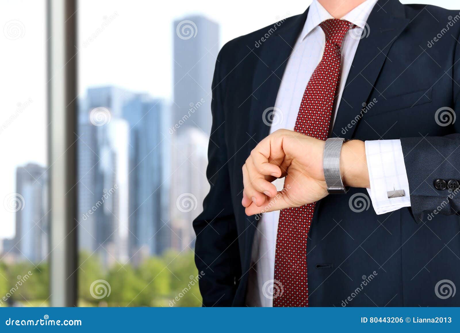 Businessman Checking Time on His Watch at Office Stock Photo - Image of ...