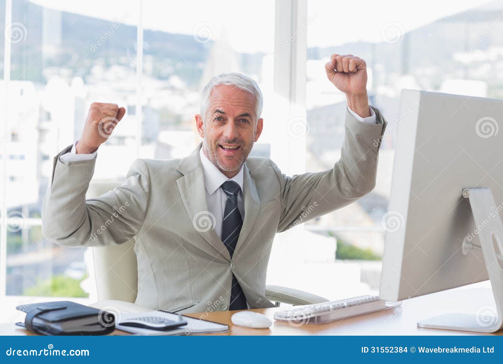 Businessman Cheering in His Office Stock Photo - Image of keyboard ...