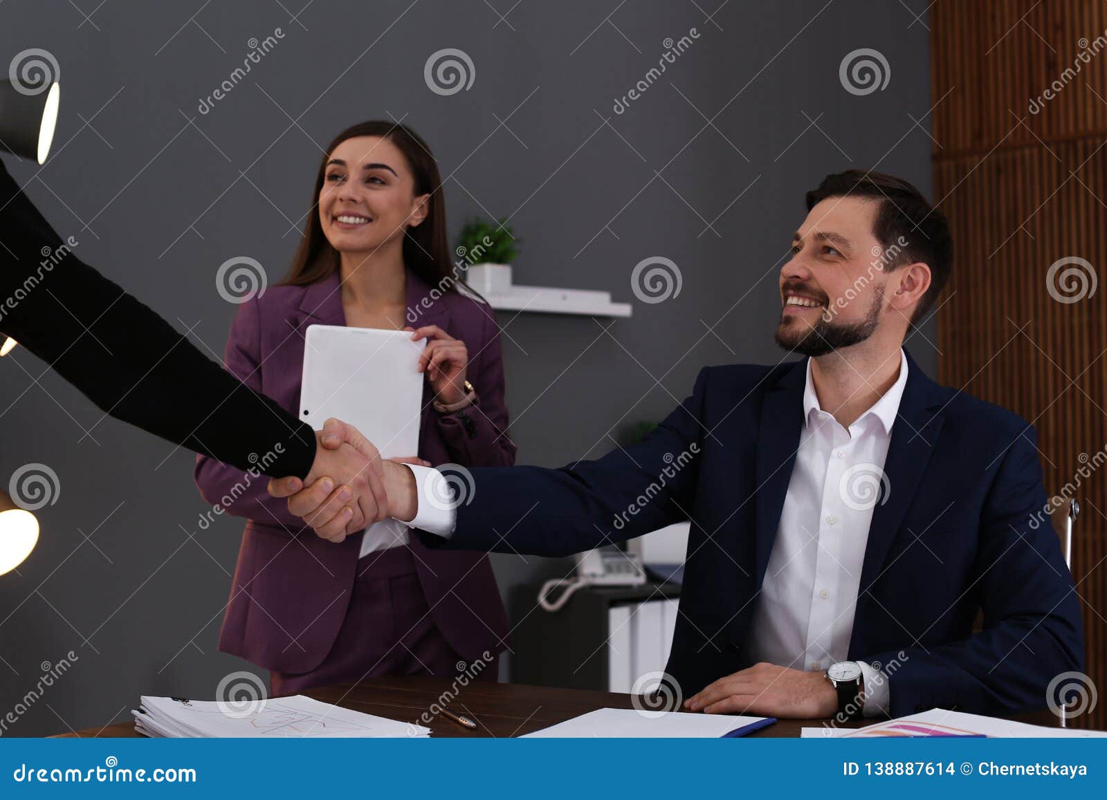Businessman and Client Shaking Hands Over Table with Documents Stock ...