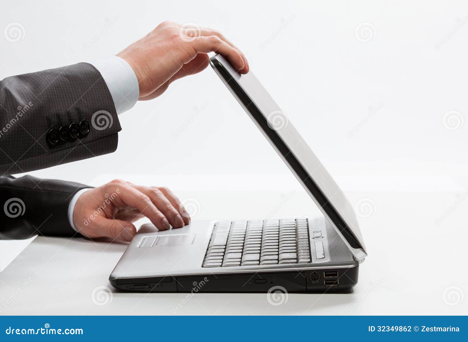 Businessman closing laptop stock photo. Image of button - 32349862