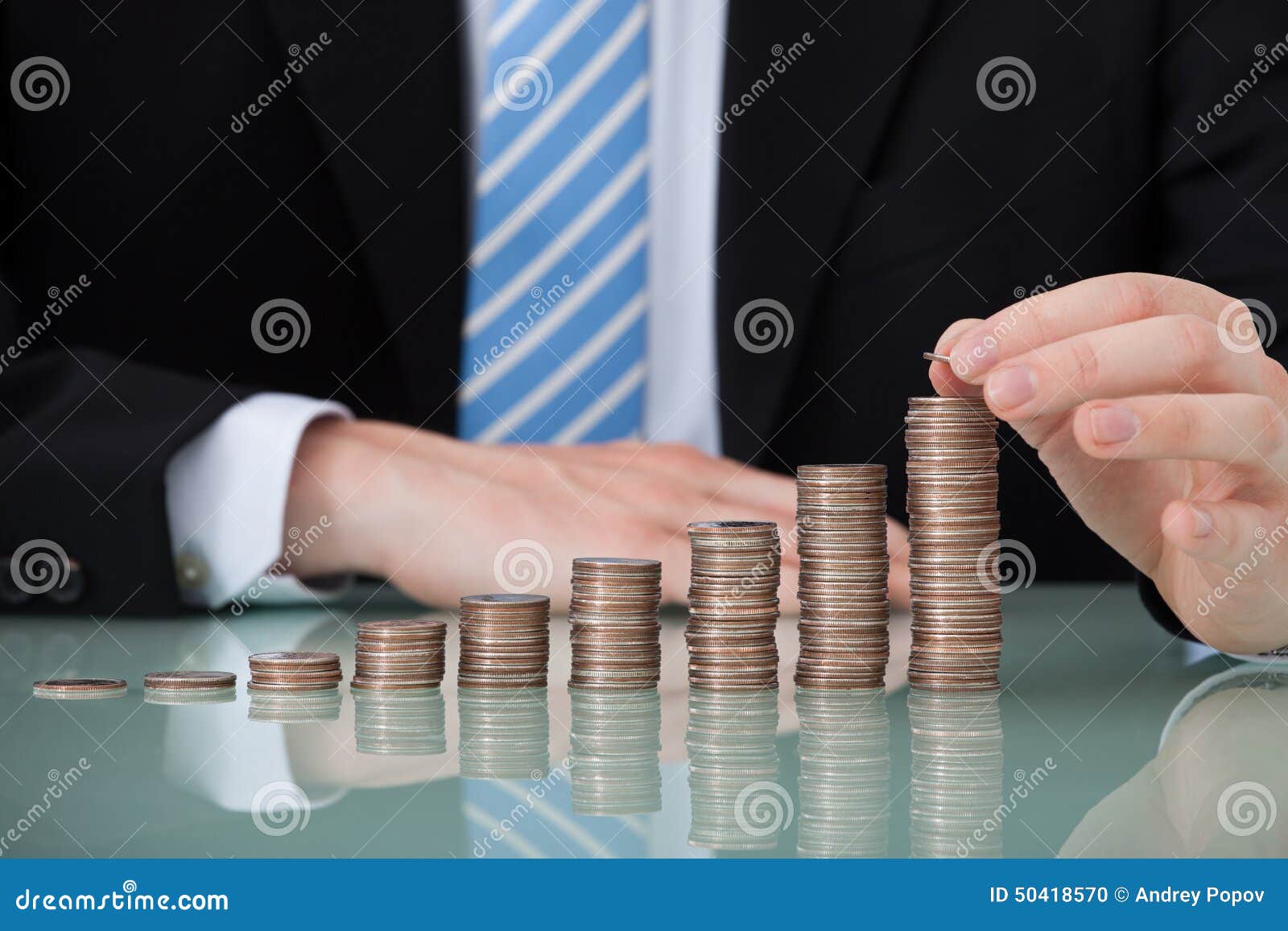 Businessman with Coins Stacked As Bar Graph Stock Photo - Image of ...