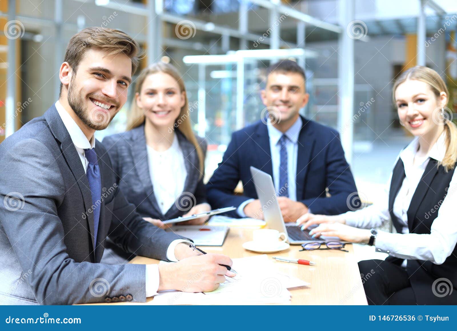 Businessman with Colleagues in the Background in Office Stock Photo ...