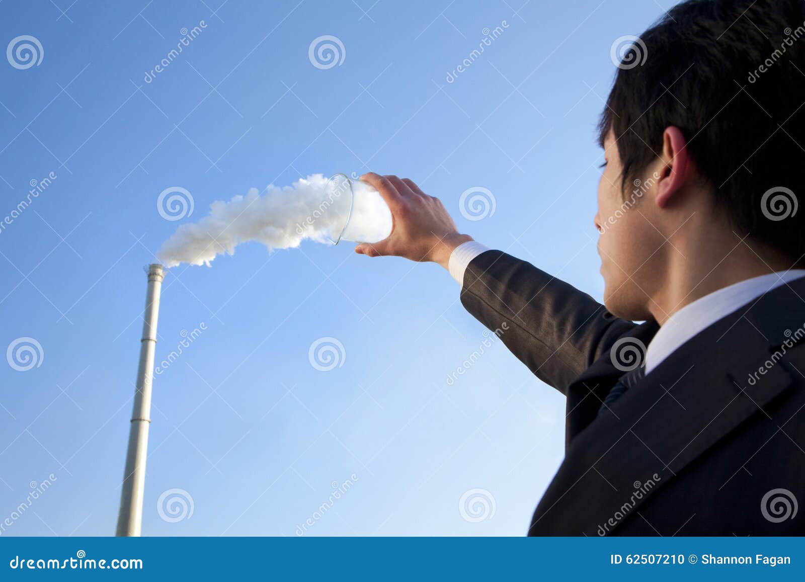 Businessman Collecting Smoke in Beaker Stock Photo - Image of asian ...