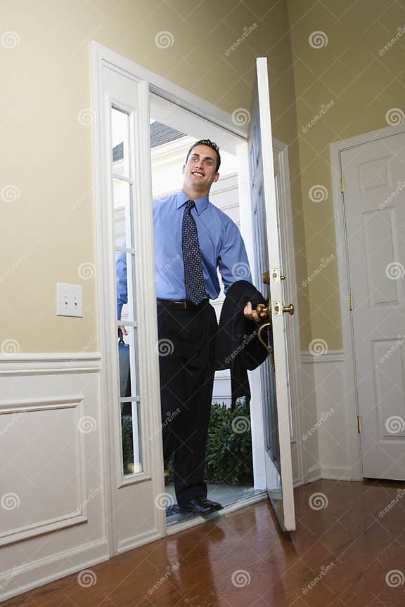 Businessman coming home. stock photo. Image of house, open - 2284510