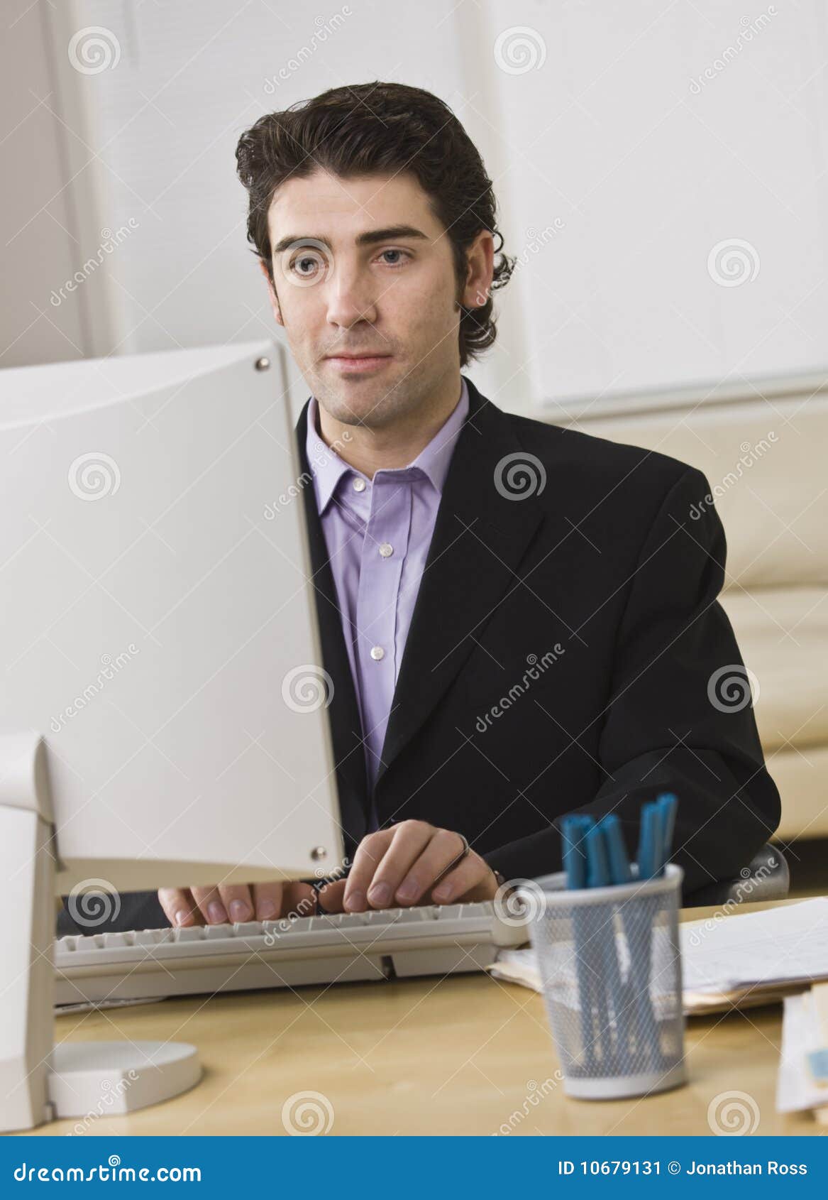 Businessman on Computer stock image. Image of lawyer - 10679131