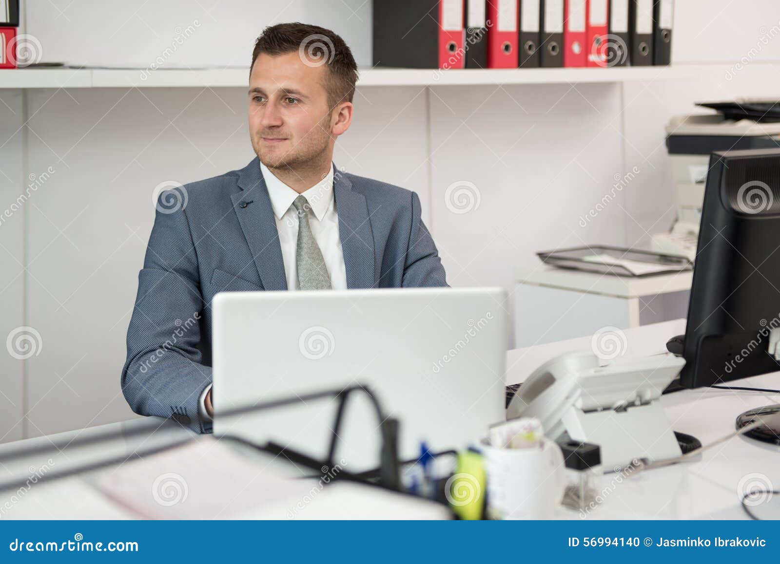 Businessman with Computer stock photo. Image of city - 56994140