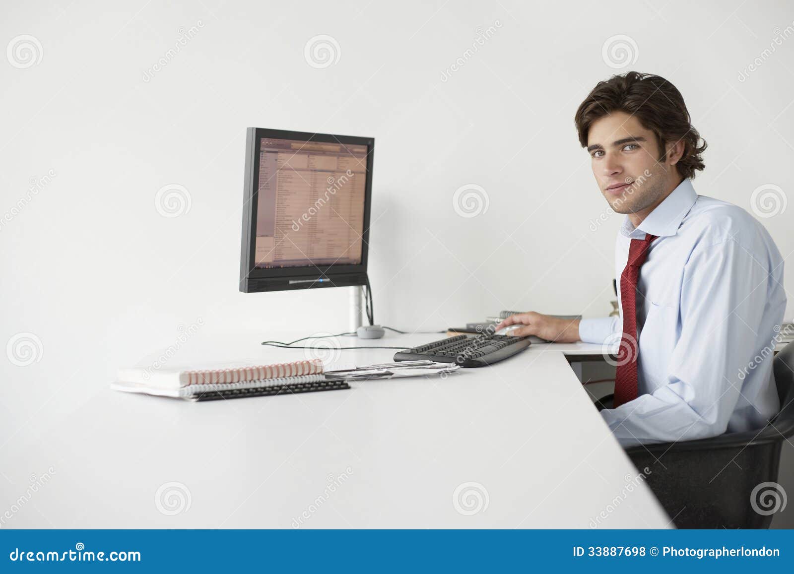 Businessman with Computer at Office Desk Stock Photo - Image of career ...