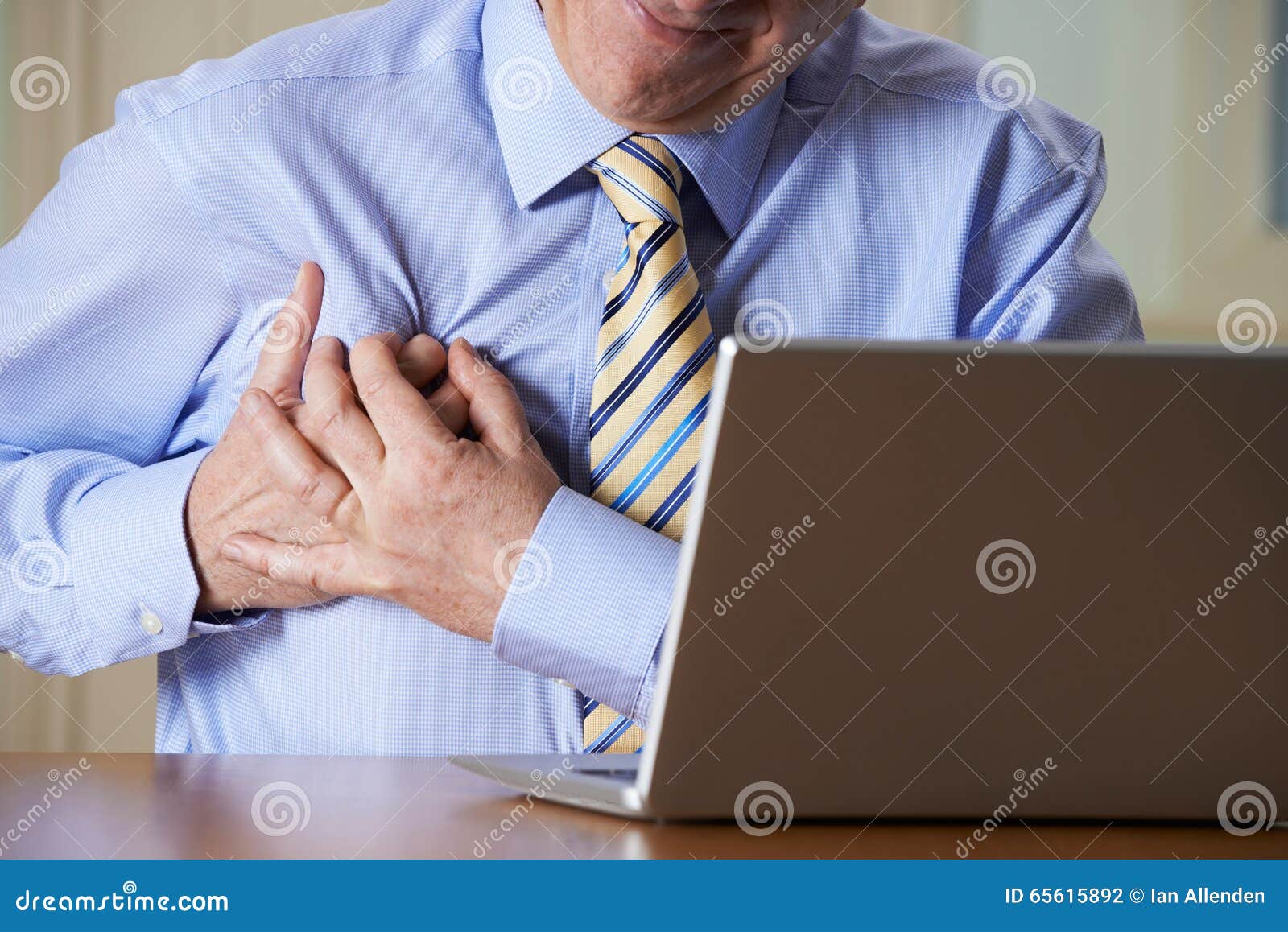 Businessman at Computer Suffering Heart Attack Stock Photo - Image of ...