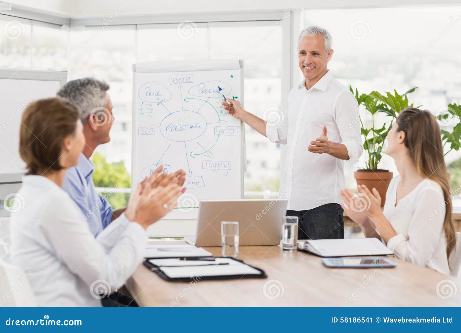 Businessman Conducting Presentation To Colleagues Stock Image - Image ...