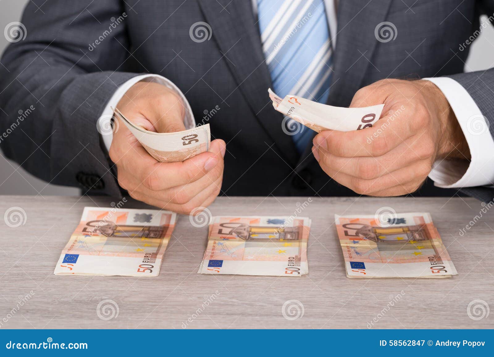 Businessman Counting Money stock image. Image of businesspeople - 58562847