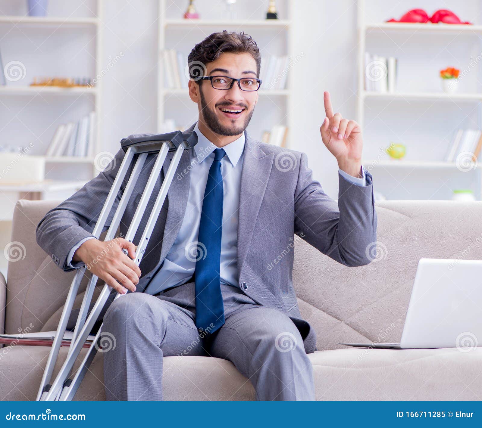 Businessman with Crutches and Broken Leg at Home Working Stock Image ...