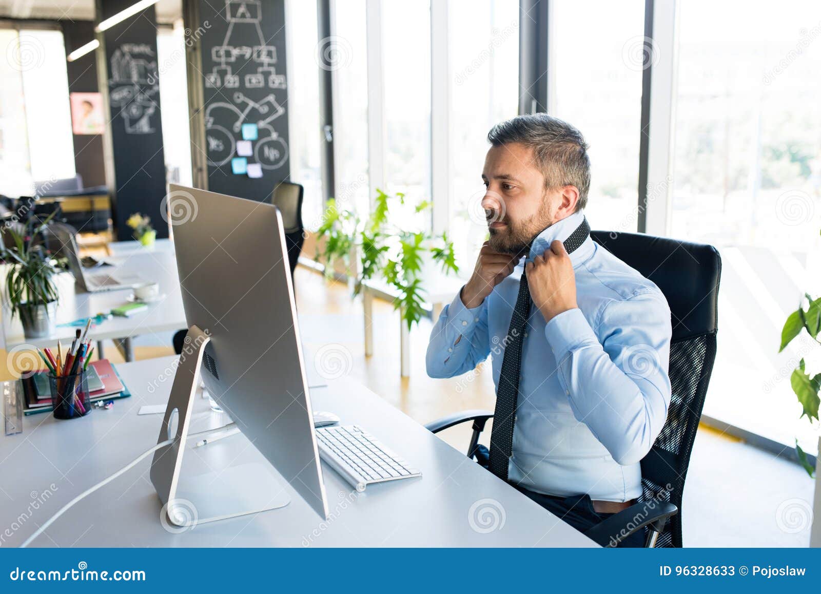 Businessman at the Desk with Computer in His Office. Stock Image ...