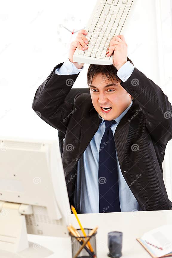 Businessman Destroying Computer Using Keyboard Stock Photo - Image of ...