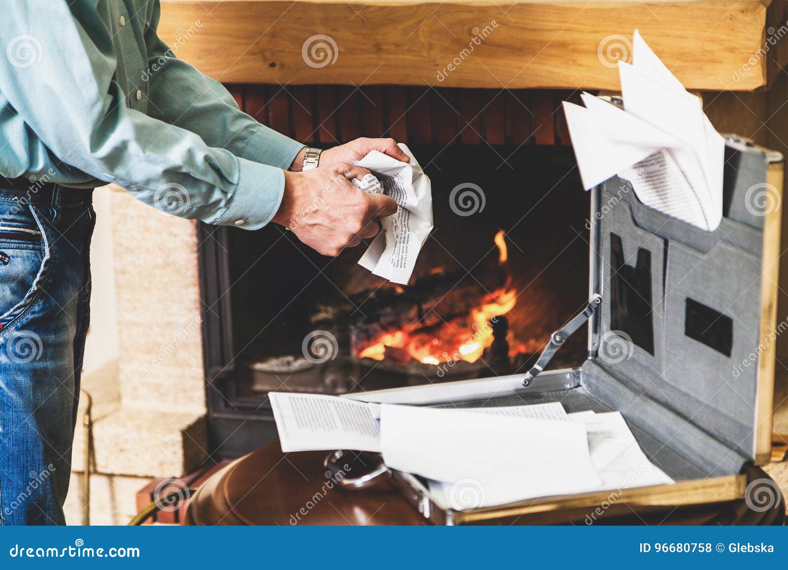 Businessman Destroying Important Documents from Case in Fireplace Stock ...
