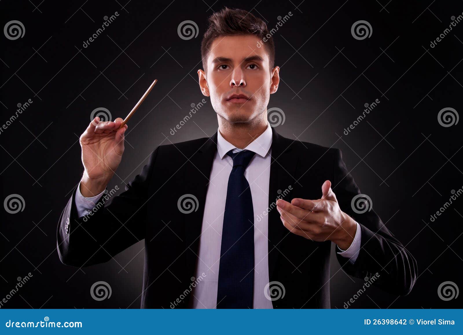 Businessman Directing with a Conductor S Stick Stock Photo - Image of ...