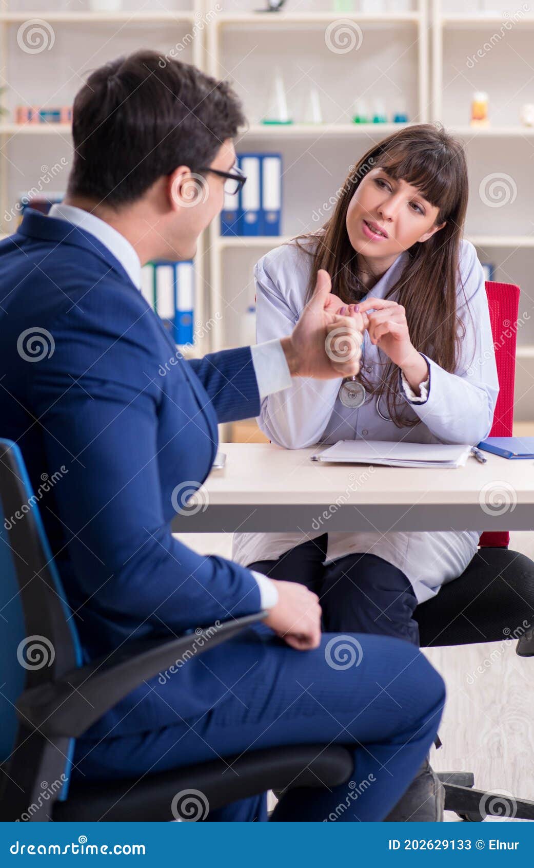 Businessman Discussing Health Issues with Doctor Stock Image - Image of ...