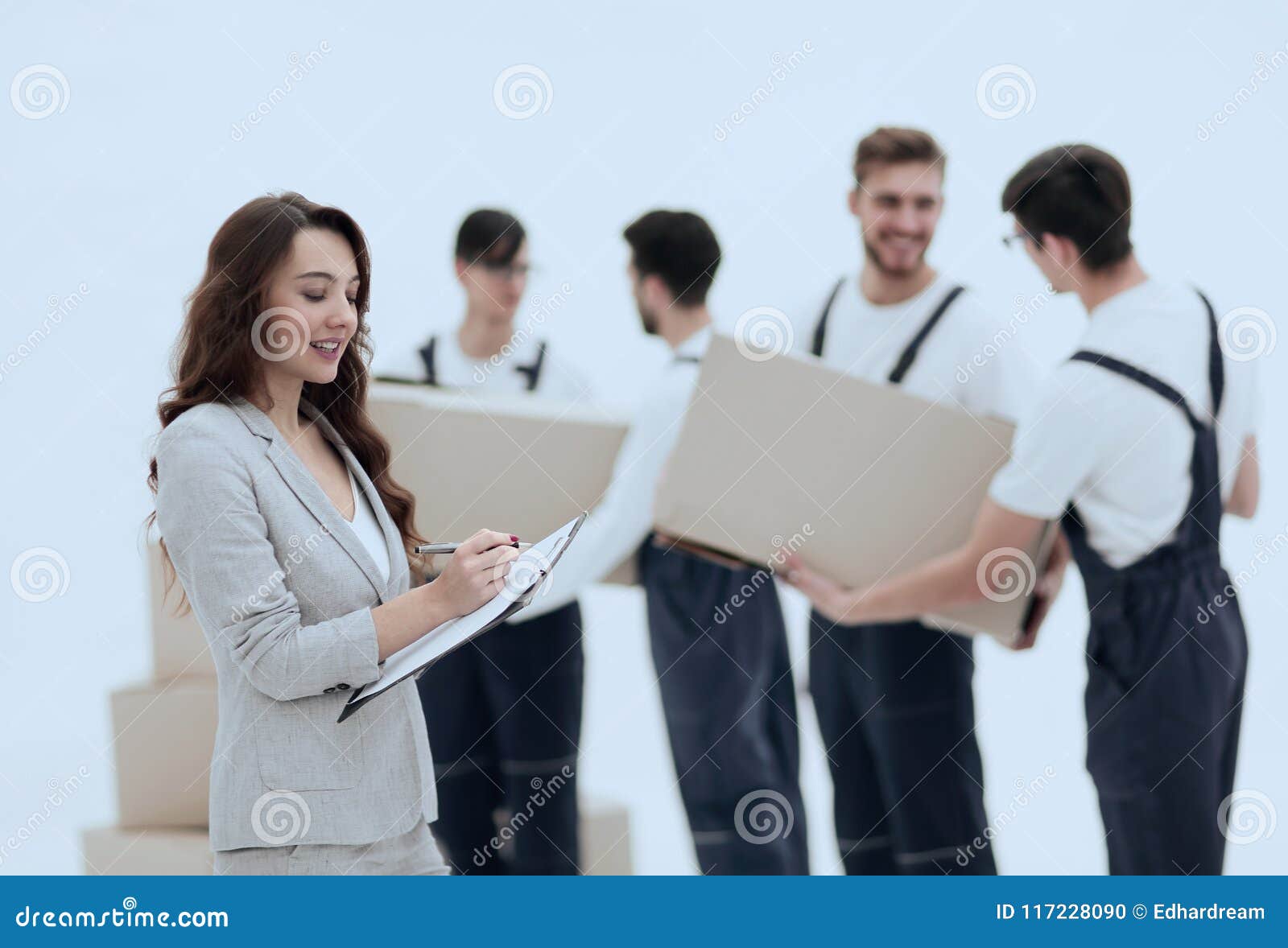 Businessman with Documents, Creating a Stack of Cardboard Boxes. Stock ...