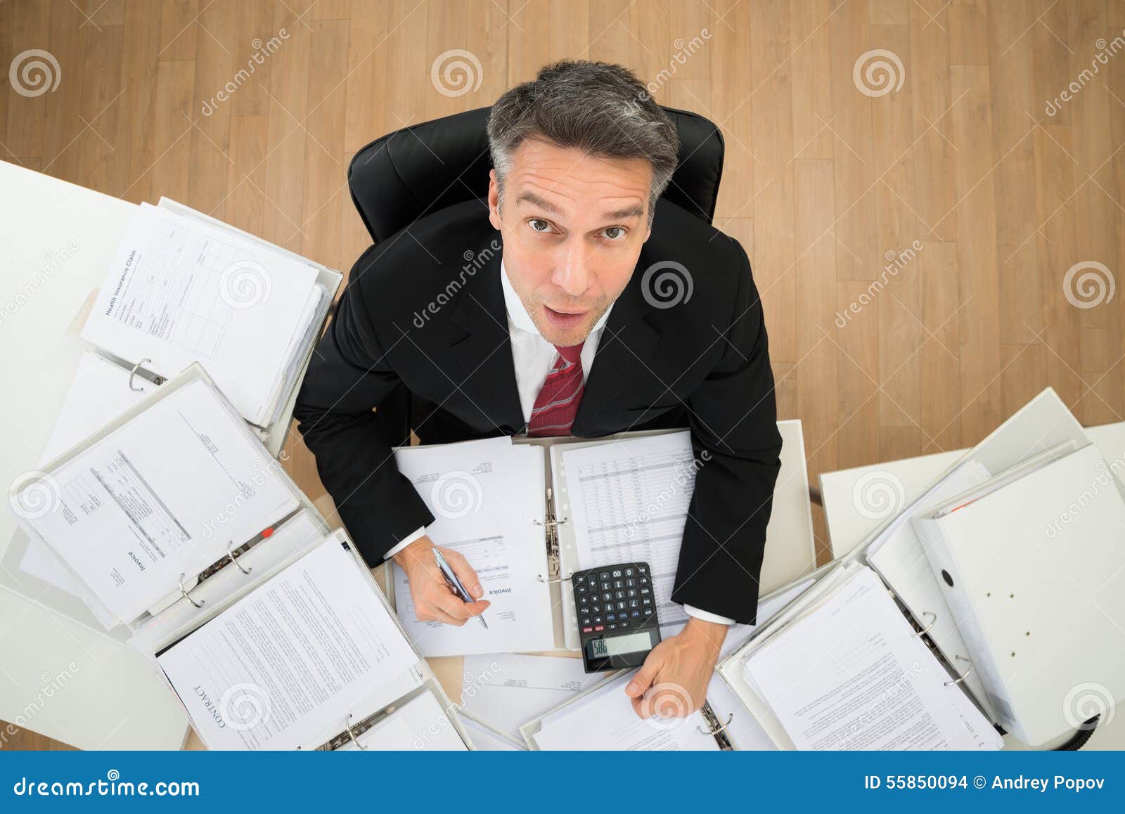 Businessman Doing Paperwork Stock Photo - Image of calculator, employee ...