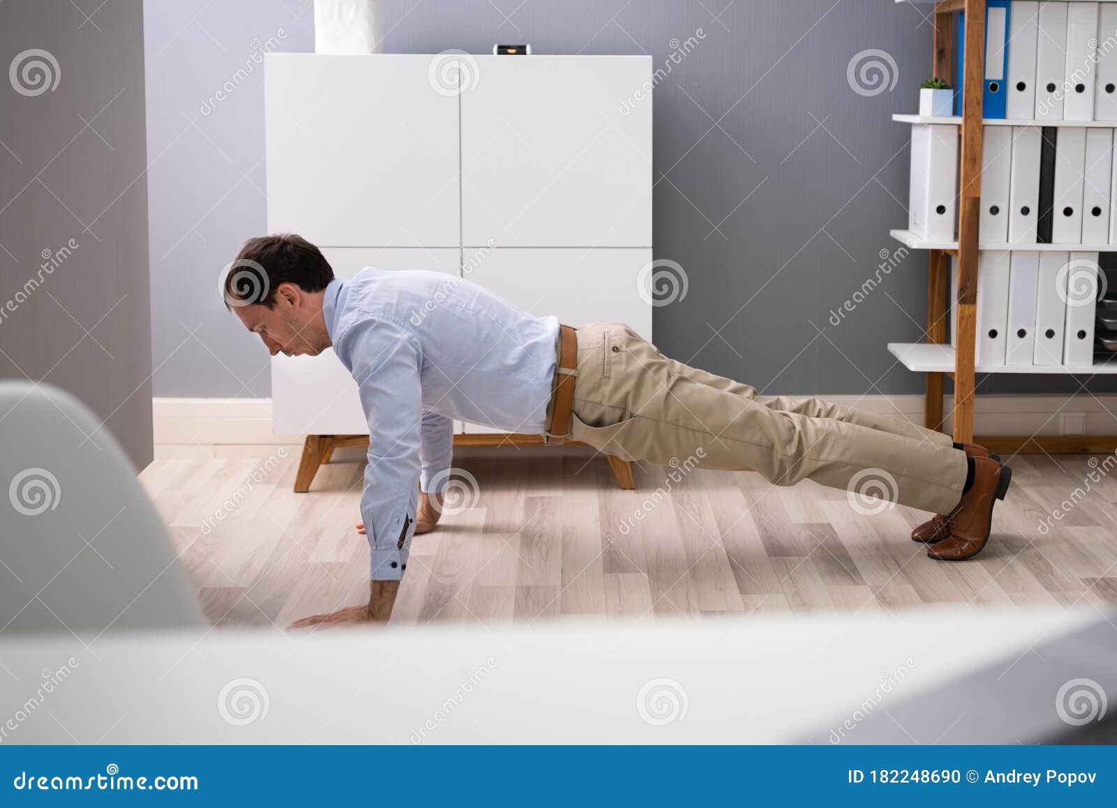 Businessman Doing Pushups at Work Stock Photo - Image of adult ...