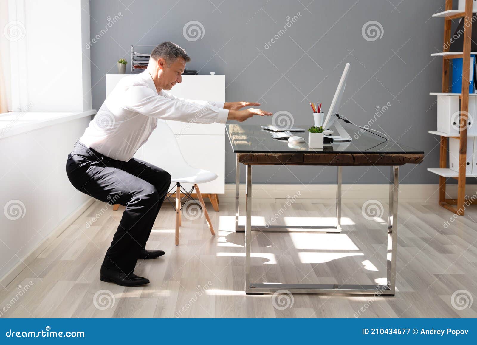Businessman Doing Squats Exercise in Office Stock Image - Image of ...