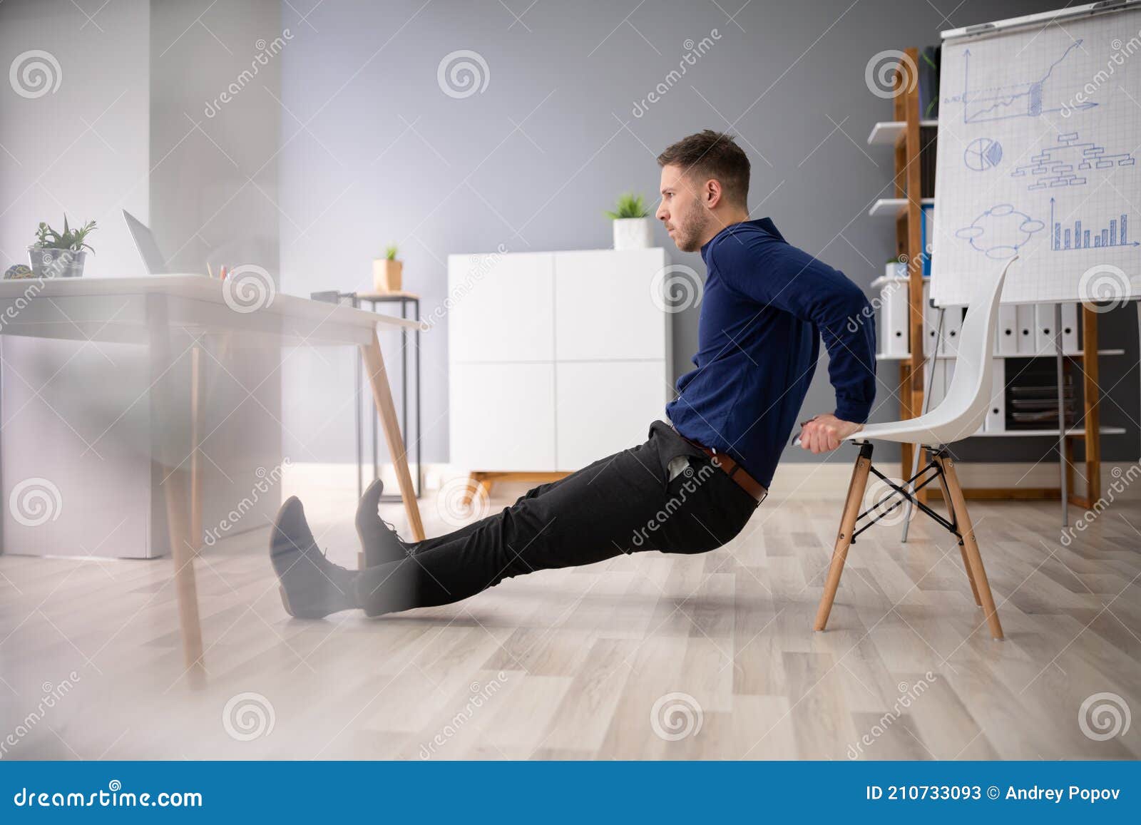 Businessman Doing Triceps Dips in Office Stock Image - Image of ...