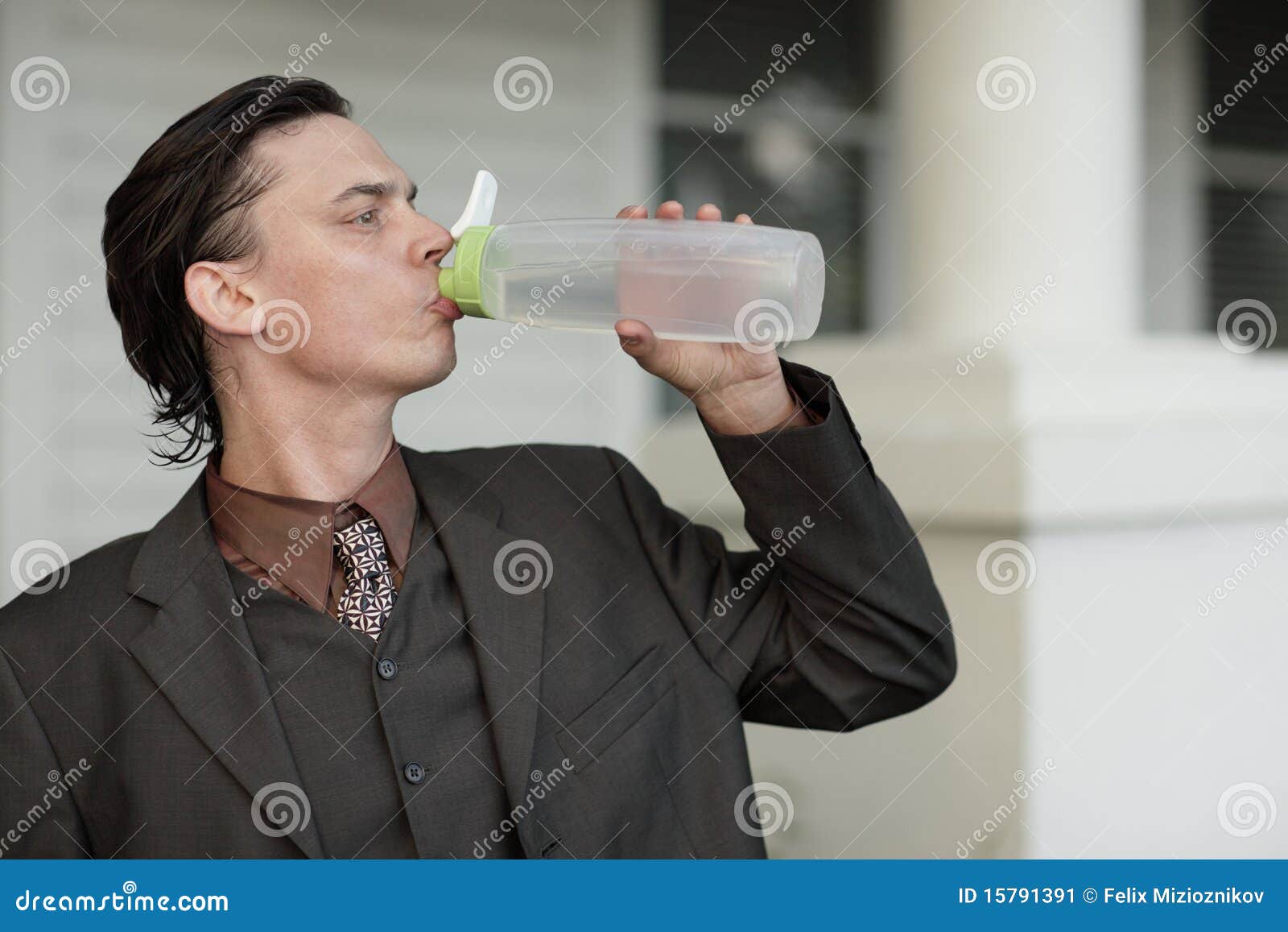 Businessman drinking water stock image. Image of male - 15791391