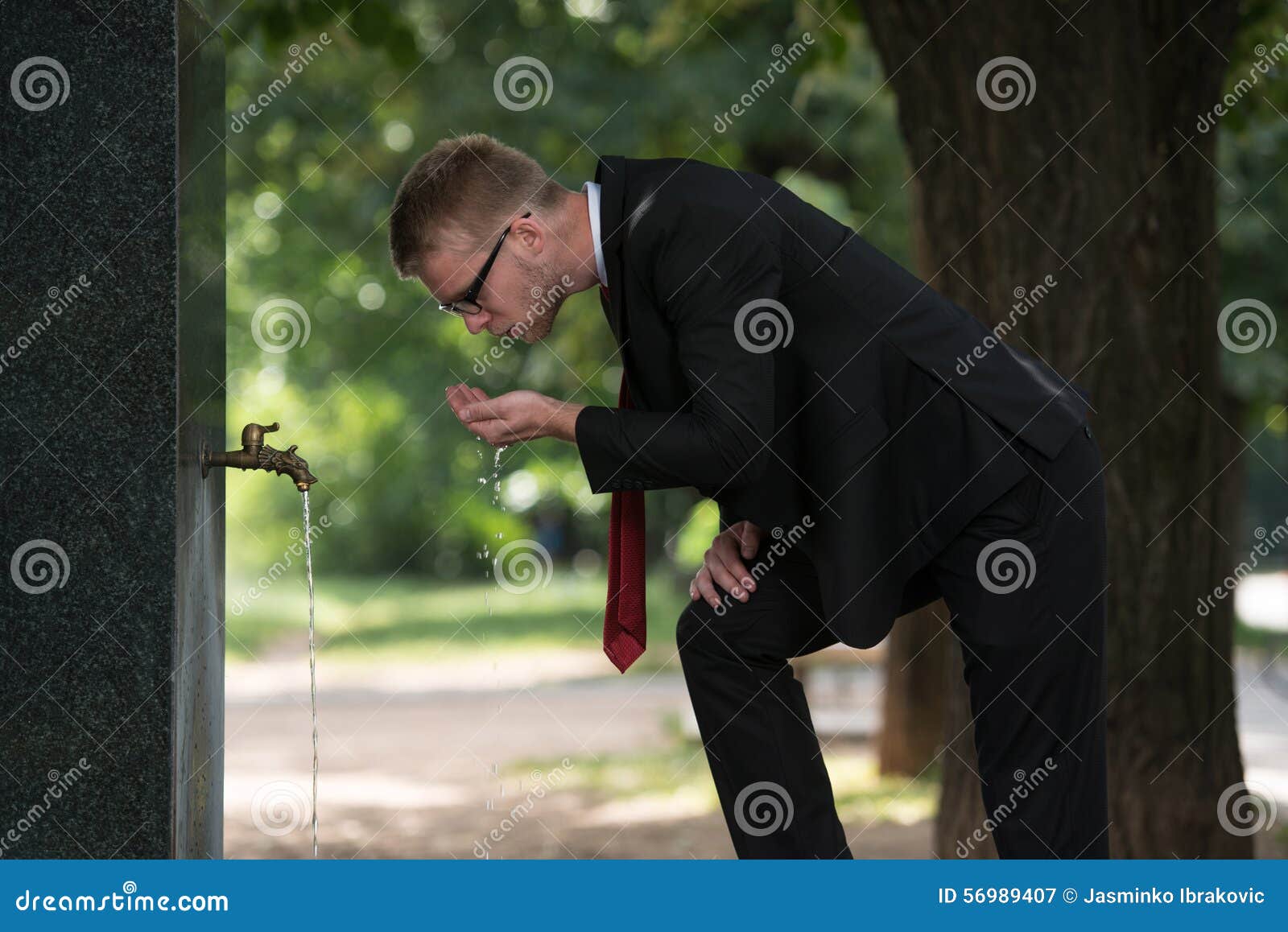 Businessman Drinking Water stock image. Image of business - 56989407