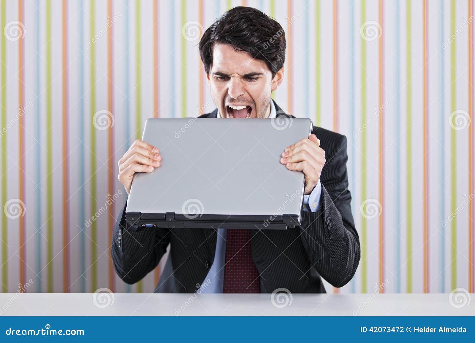 Businessman eating laptop stock photo. Image of laptop - 42073472